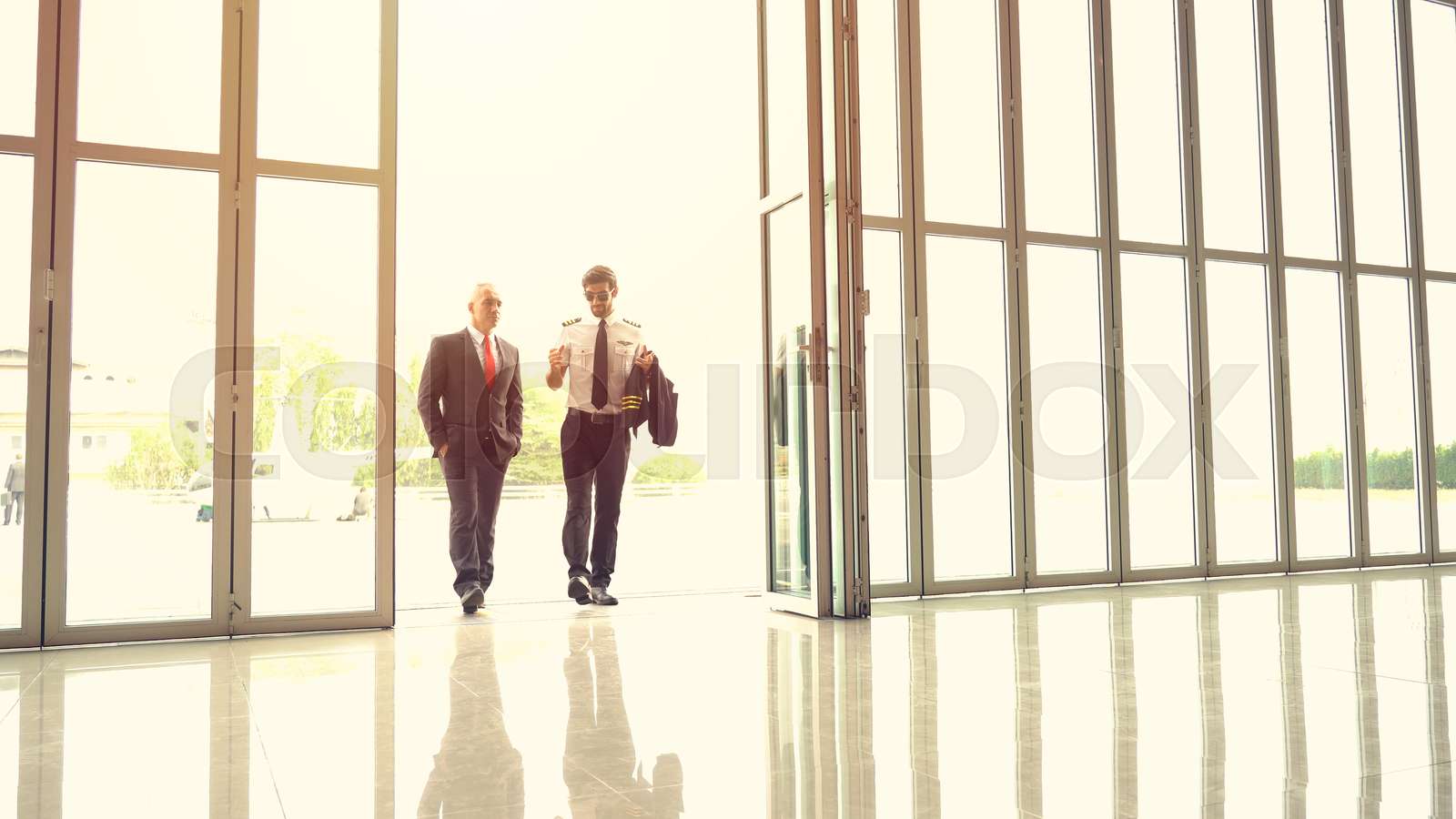 Pilot and boss talking | Stock image | Colourbox