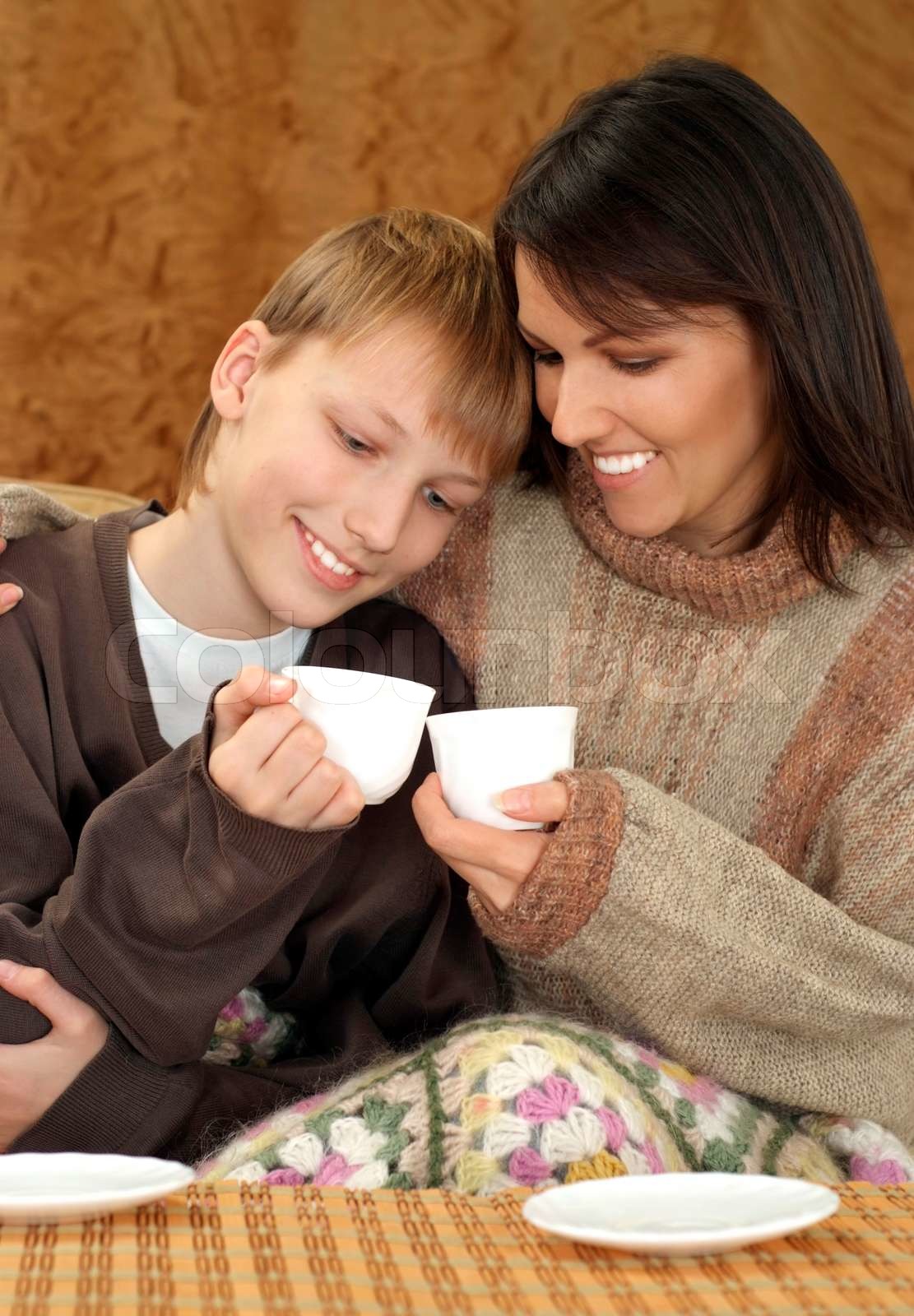 Beautiful Caucasian male with his mother sitting | Stock image | Colourbox