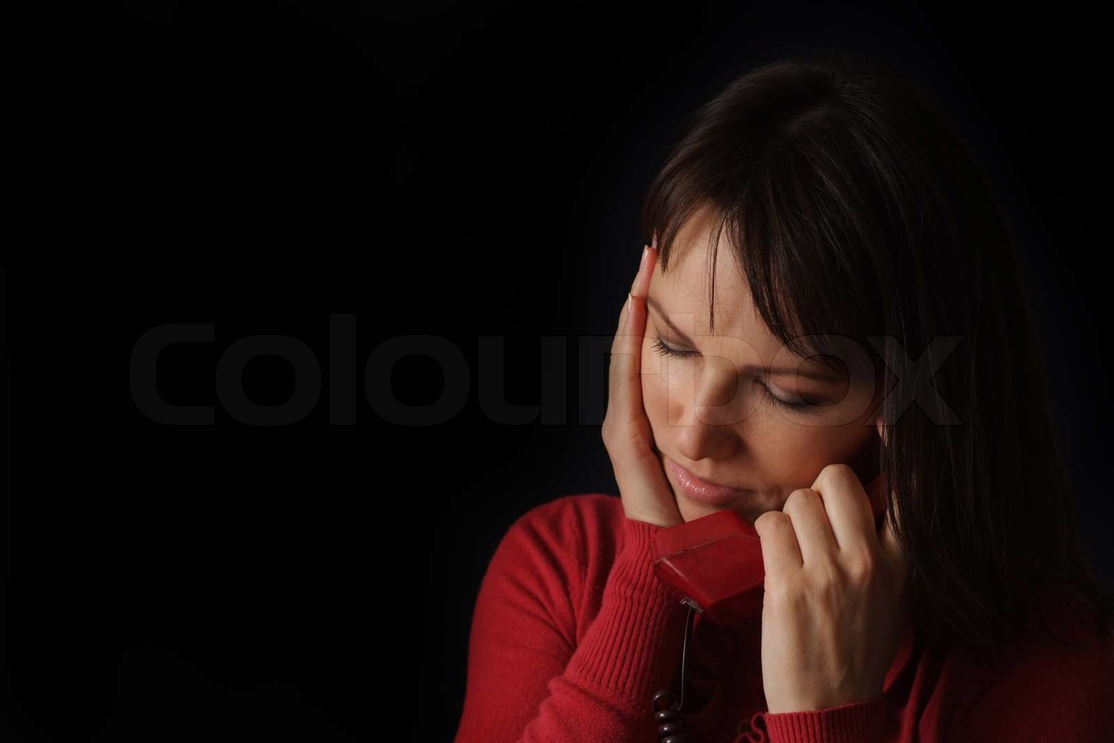 Happy sad Caucasian woman talking on the phone | Stock image | Colourbox