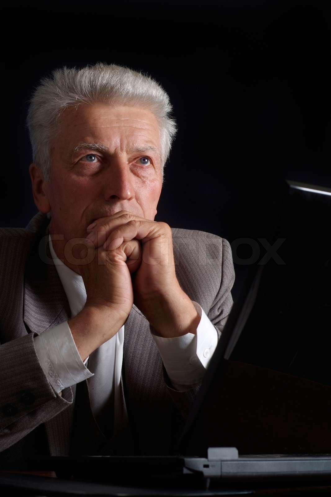 Pensive old man in suit | Stock image | Colourbox