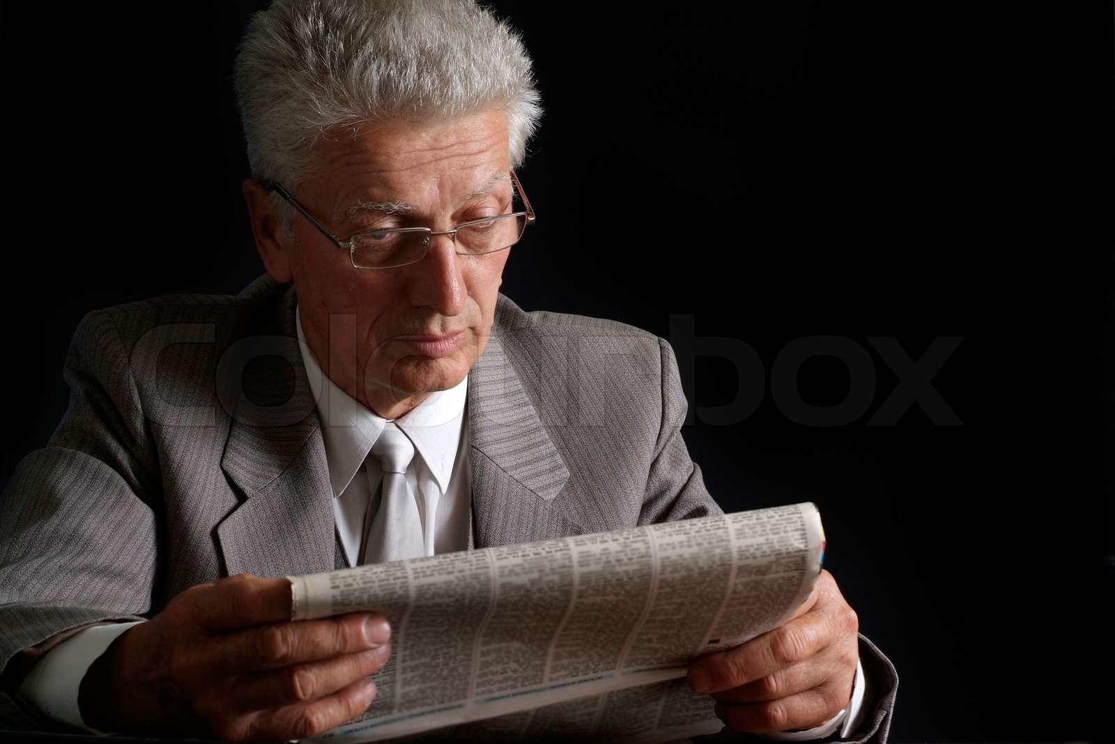 Concentrated old man in suit | Stock image | Colourbox