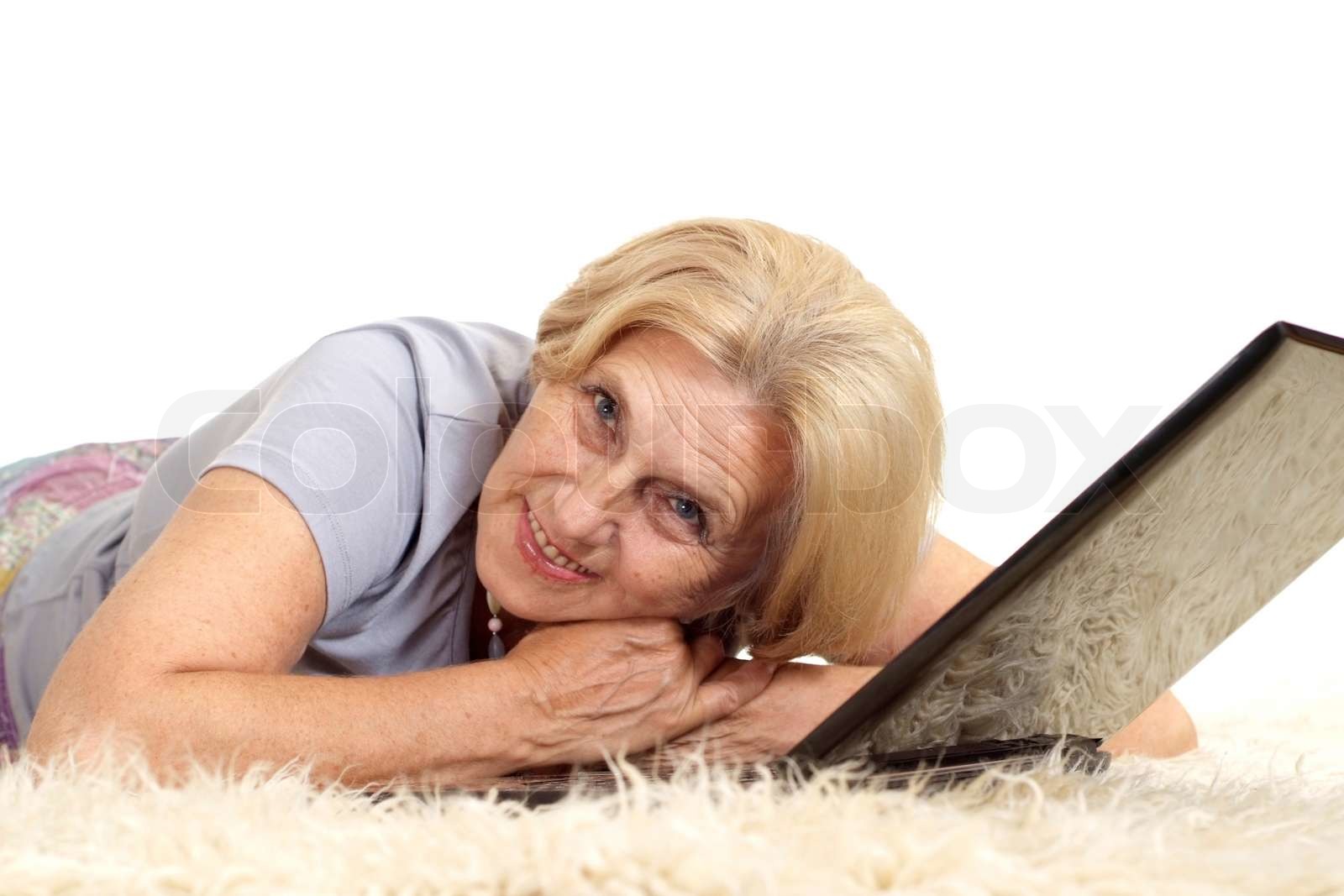 Pretty old lady at home | Stock image | Colourbox