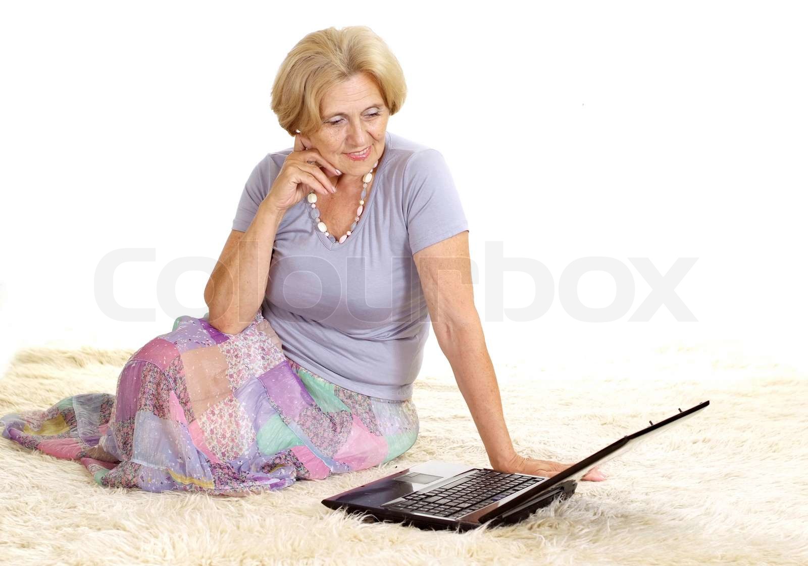 Beautiful old lady at home | Stock image | Colourbox