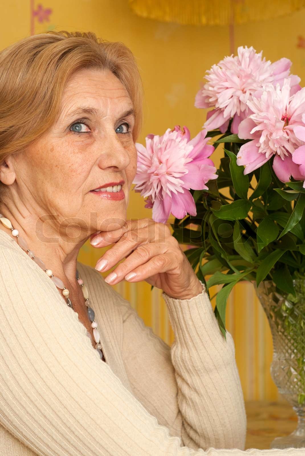 Beautiful old lady is resting at home | Stock image | Colourbox