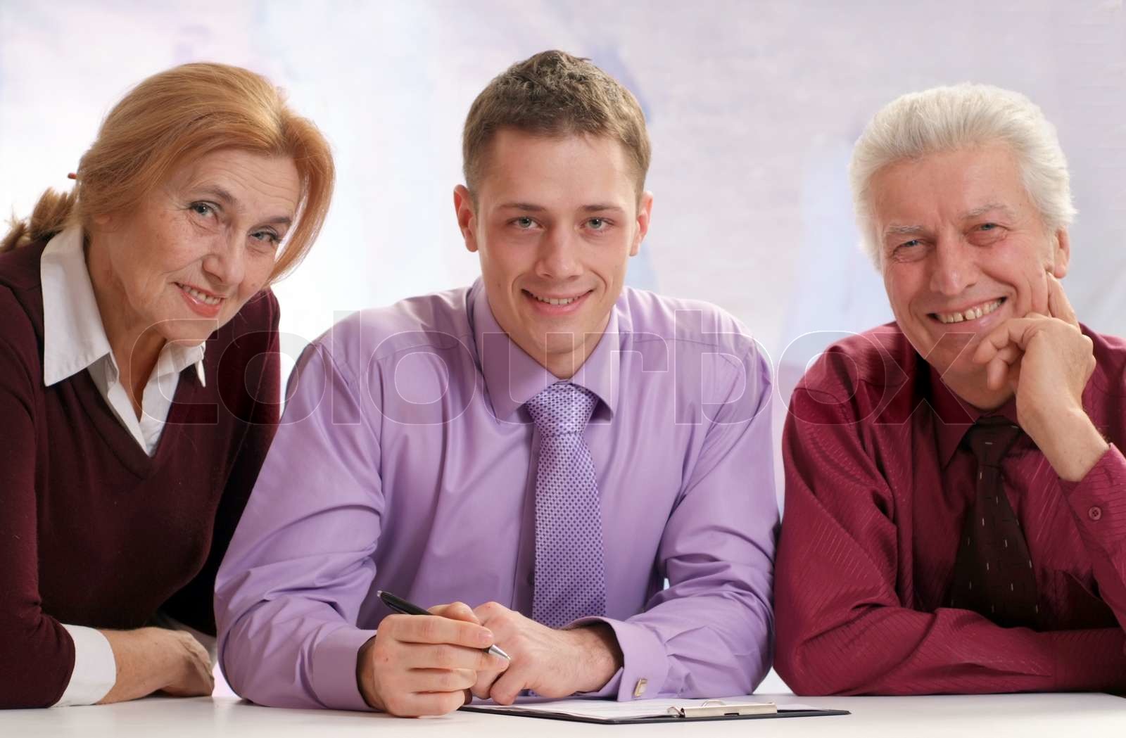 team of three people sitting | Stock image | Colourbox