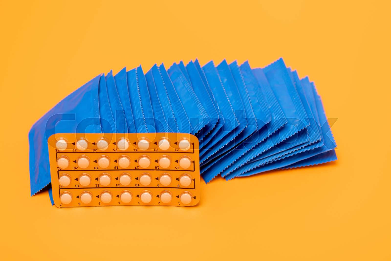 blister pack with contraceptive pills near packs with condoms isolated ...