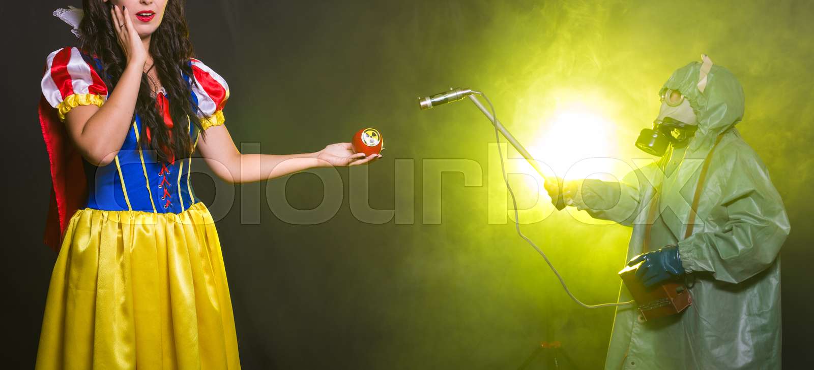Woman holding hazardous radioactive apple. Nuclear and radiation ...