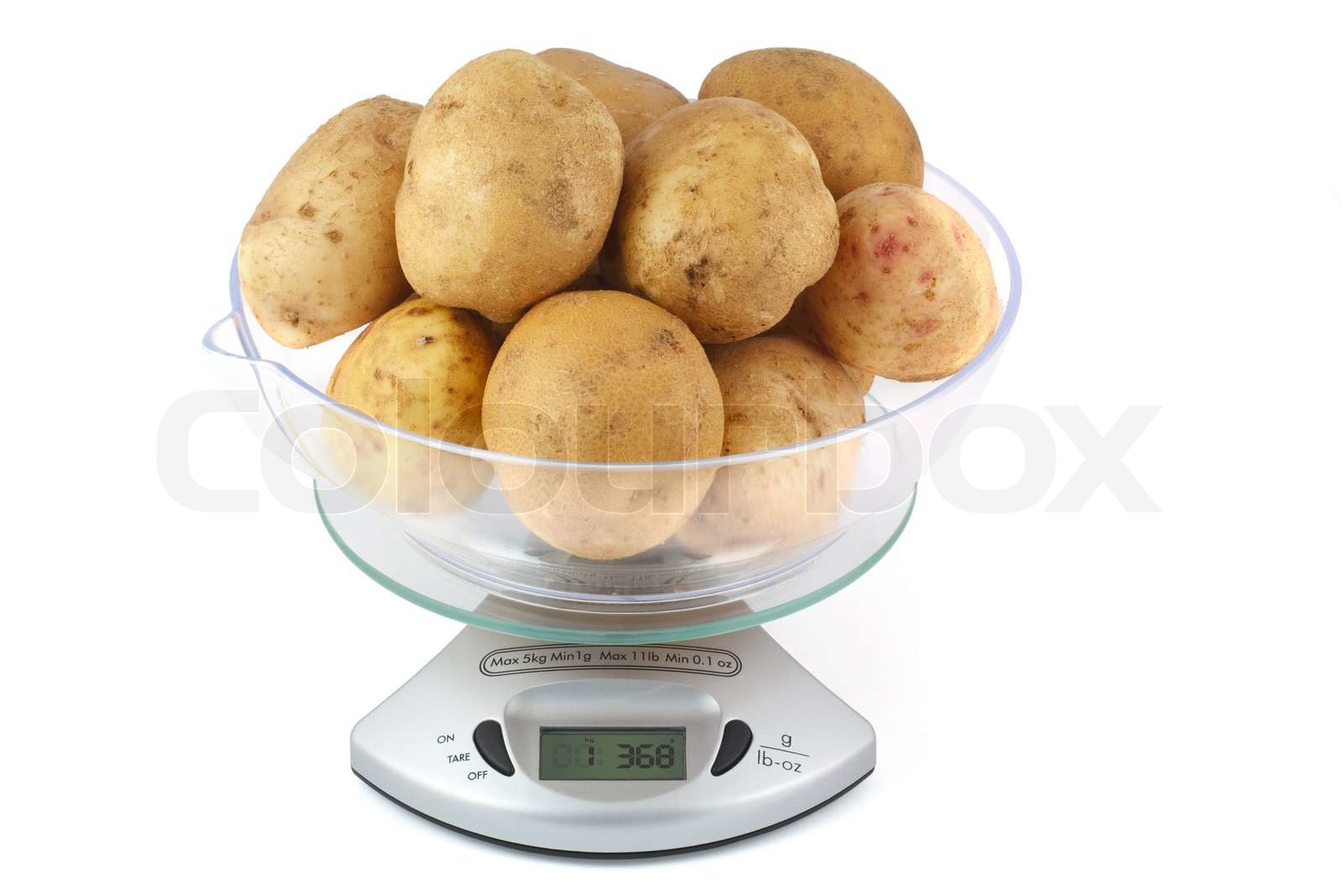 potato weighed on kitchen scales | Stock image | Colourbox