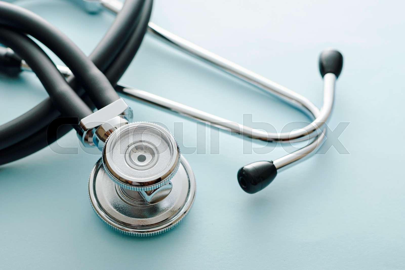 Coiled stethoscope from above on white | Stock image | Colourbox