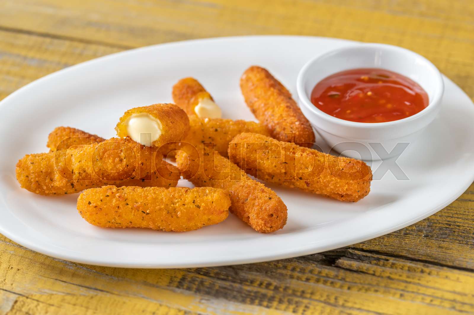 Mozzarella sticks with chili sauce | Stock image | Colourbox
