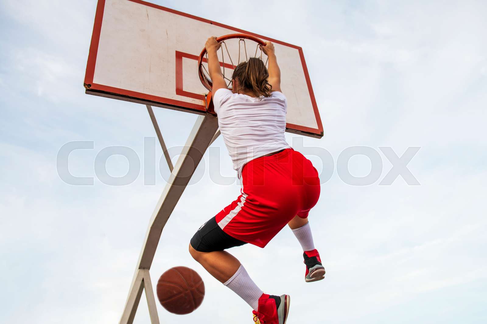 Girl Basketball Player Dunking