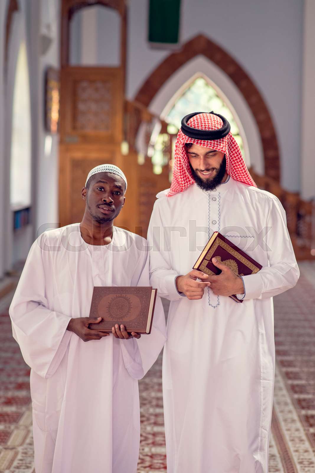 Two religious muslim man praying together inside the mosque | Stock ...