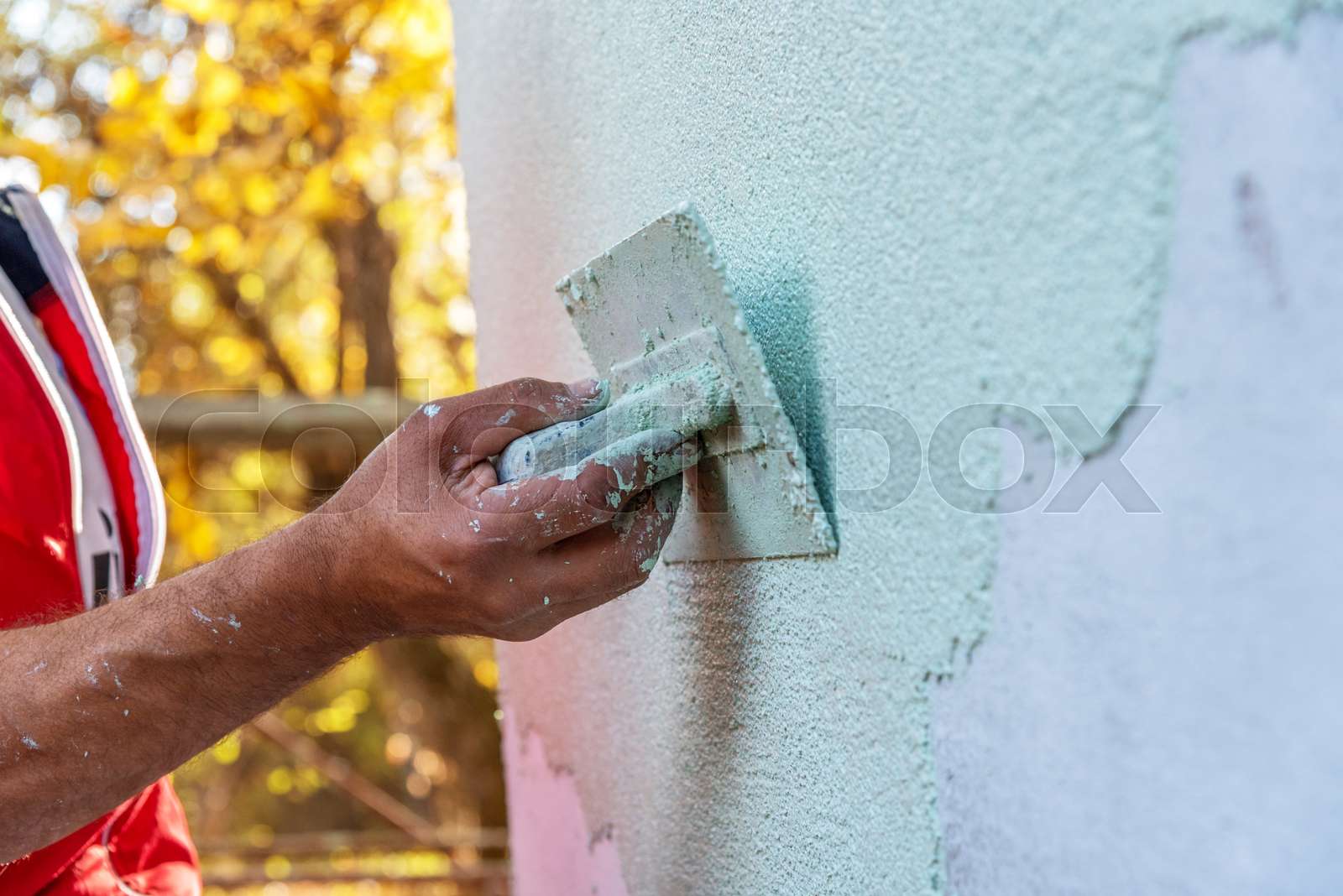 Application Of Facade Plaster. | Stock image | Colourbox