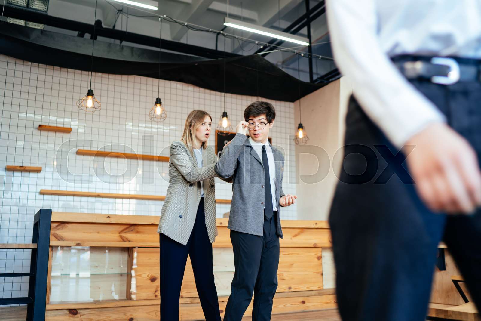 Two coworkers Staring and Gossiping About Their Female Colleague ...