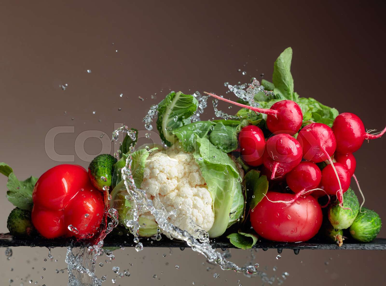 Various fresh raw vegetables with water splash. | Stock image | Colourbox