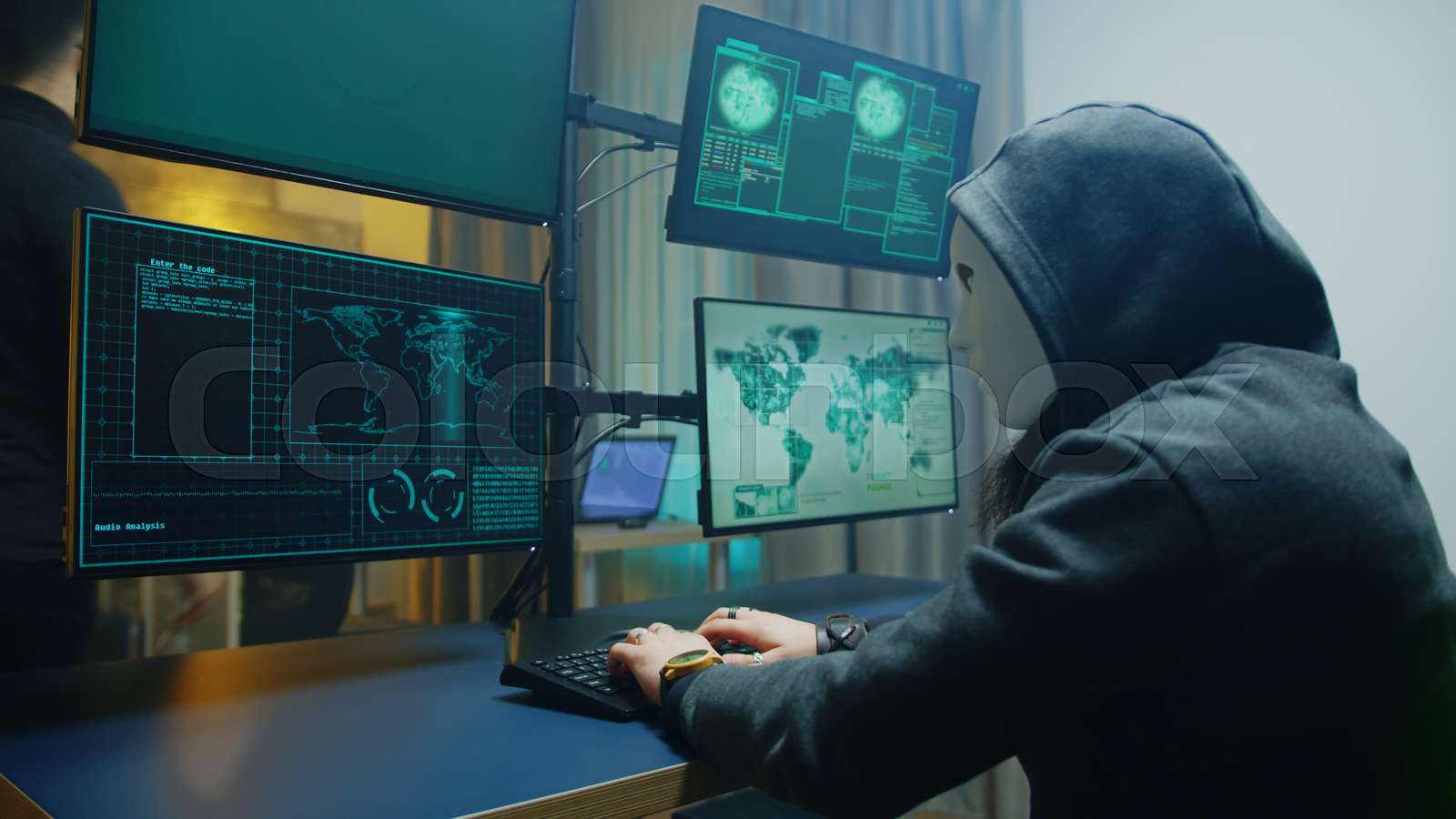 Side view of masked hacker writing a dangerous malware | Stock image ...