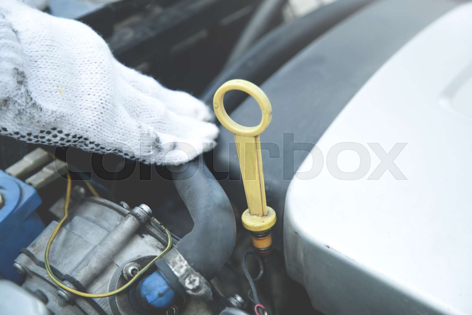Yellow oil dipstick. Measuring level of engine oil | Stock image ...