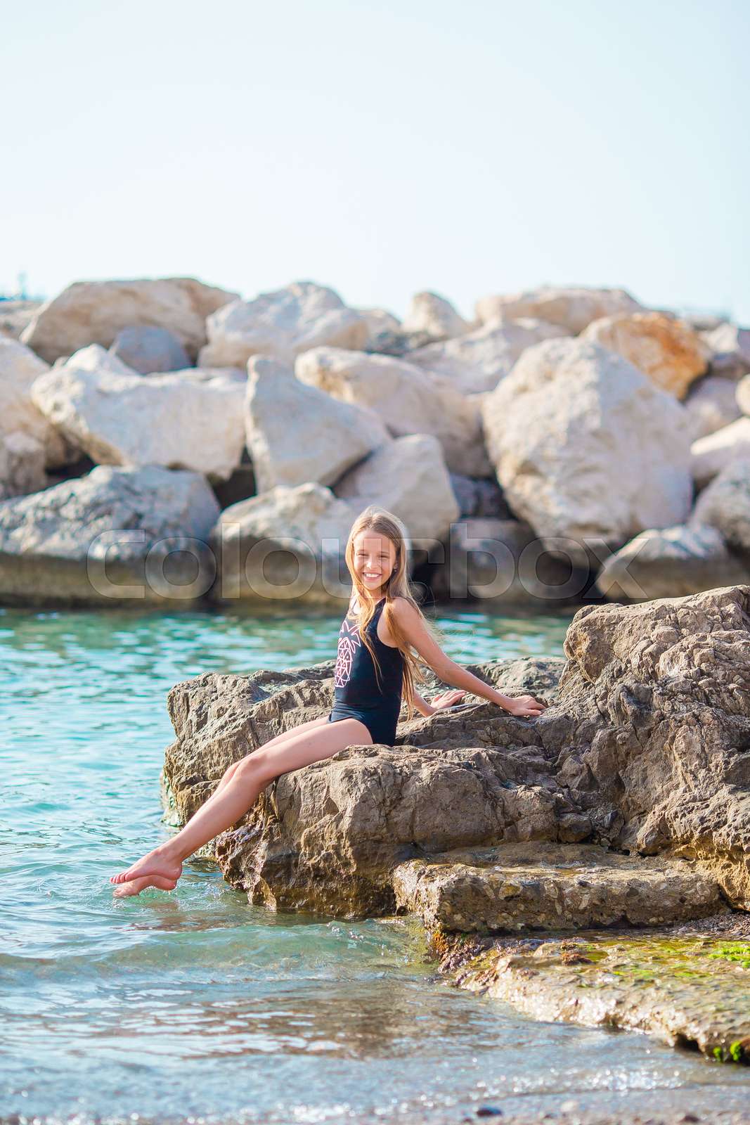 Cute little girl at beach during summer vacation | Stock image | Colourbox