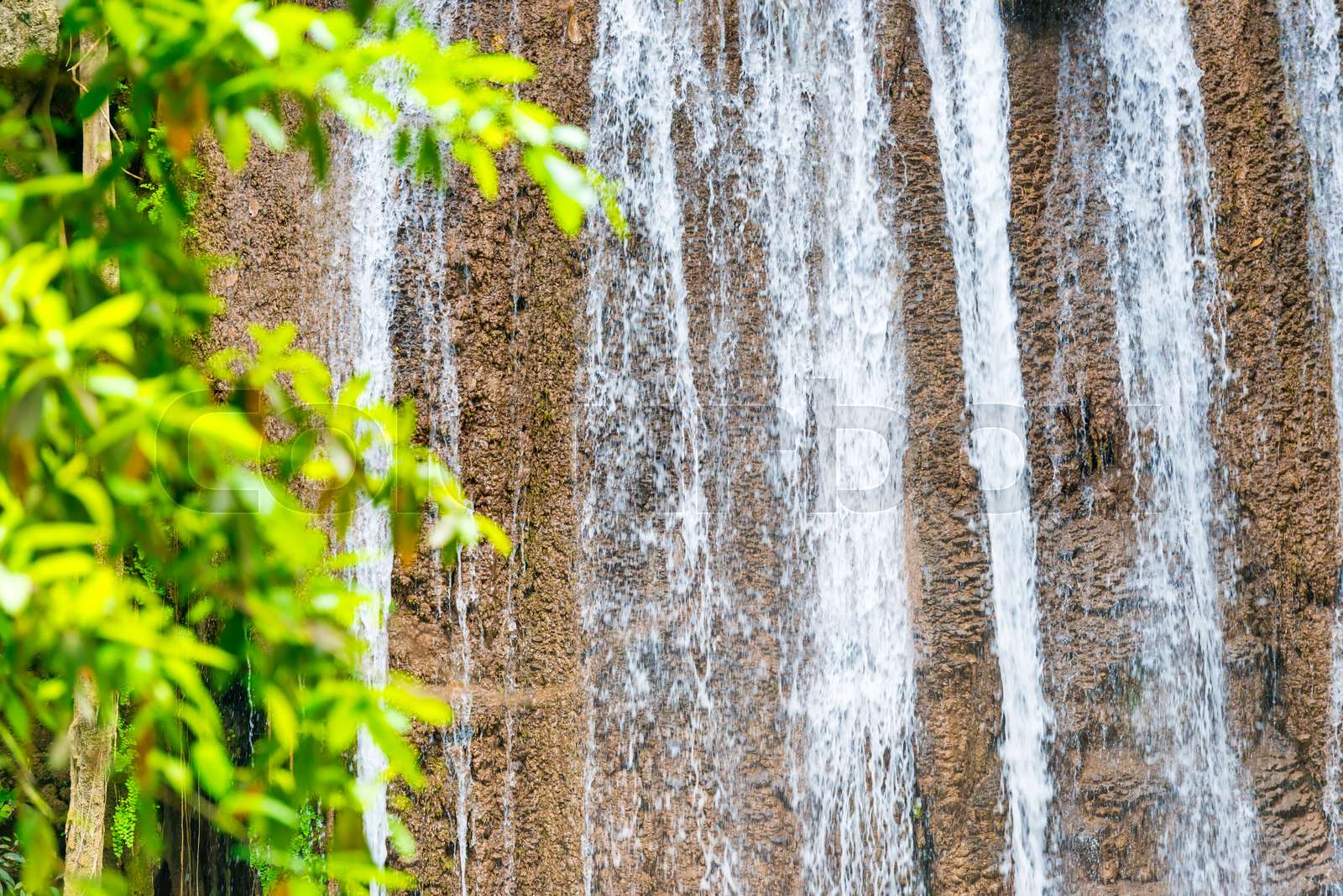 Streams of waterfall flowing down from cascade | Stock image | Colourbox