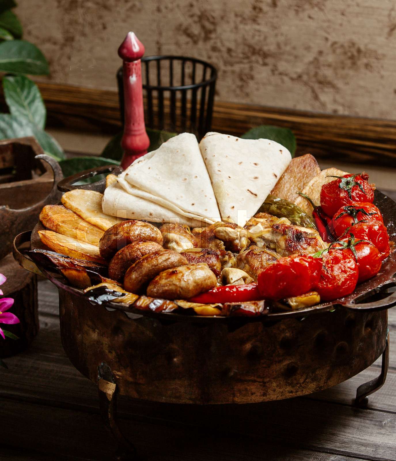 chicken saj with mushroom, potato, tomato, aubergine and flatbread ...