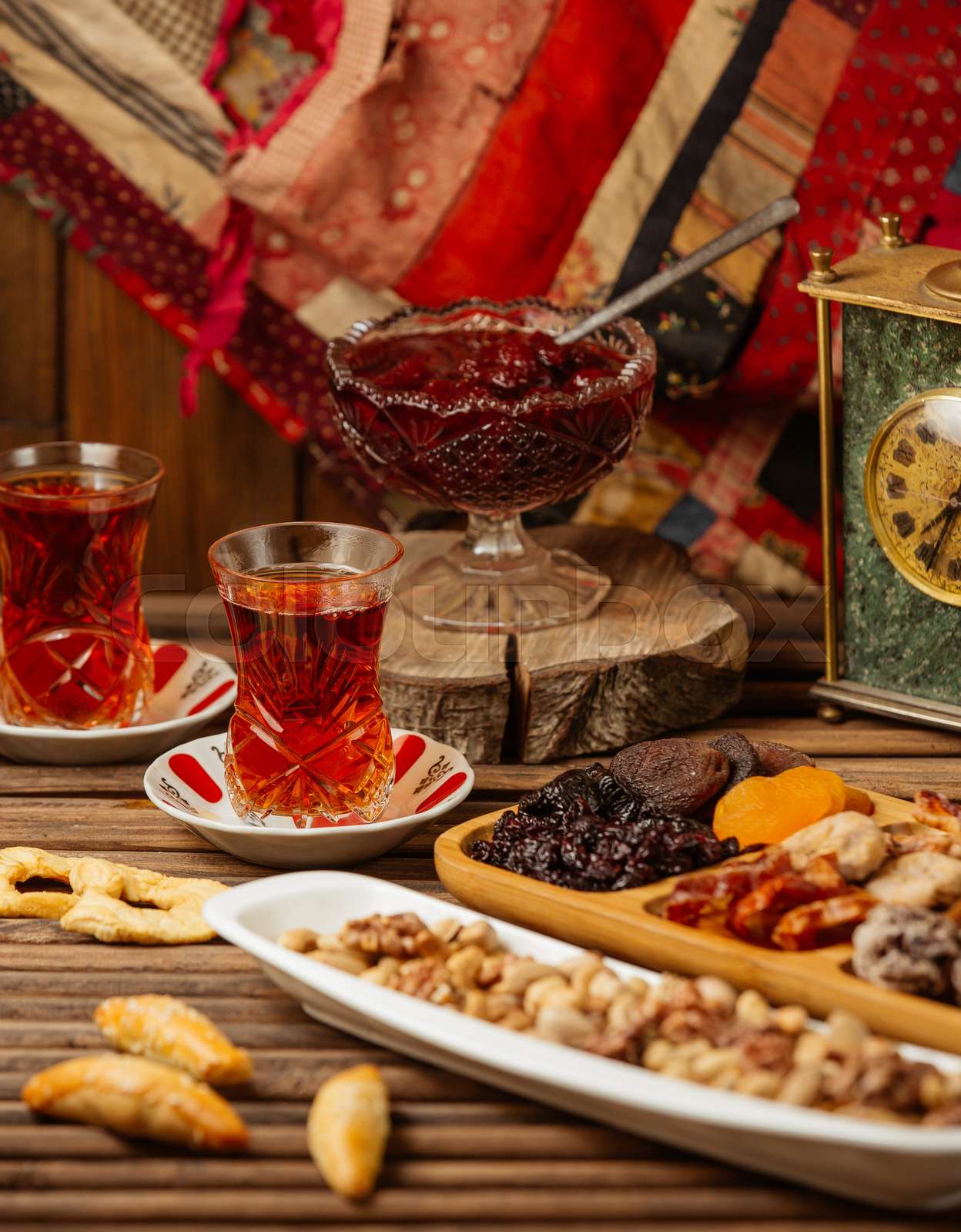 azerbaijani tea setup with tea in armudu glass, dried fruits and nuts ...