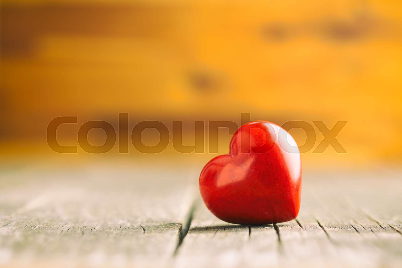 Red heart on wooden table. | Stock image | Colourbox