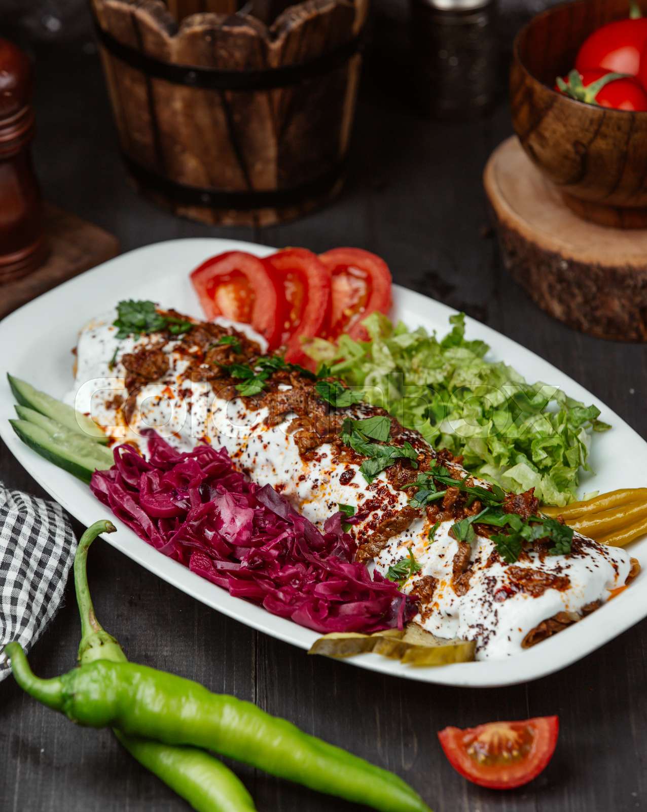 Turkish adana kebab with minced meat served with yoghurt and salads ...