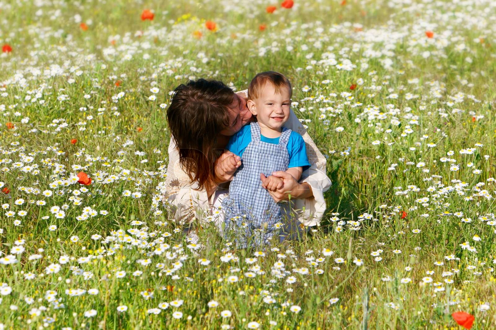 mother and child in flower field | Stock image | Colourbox