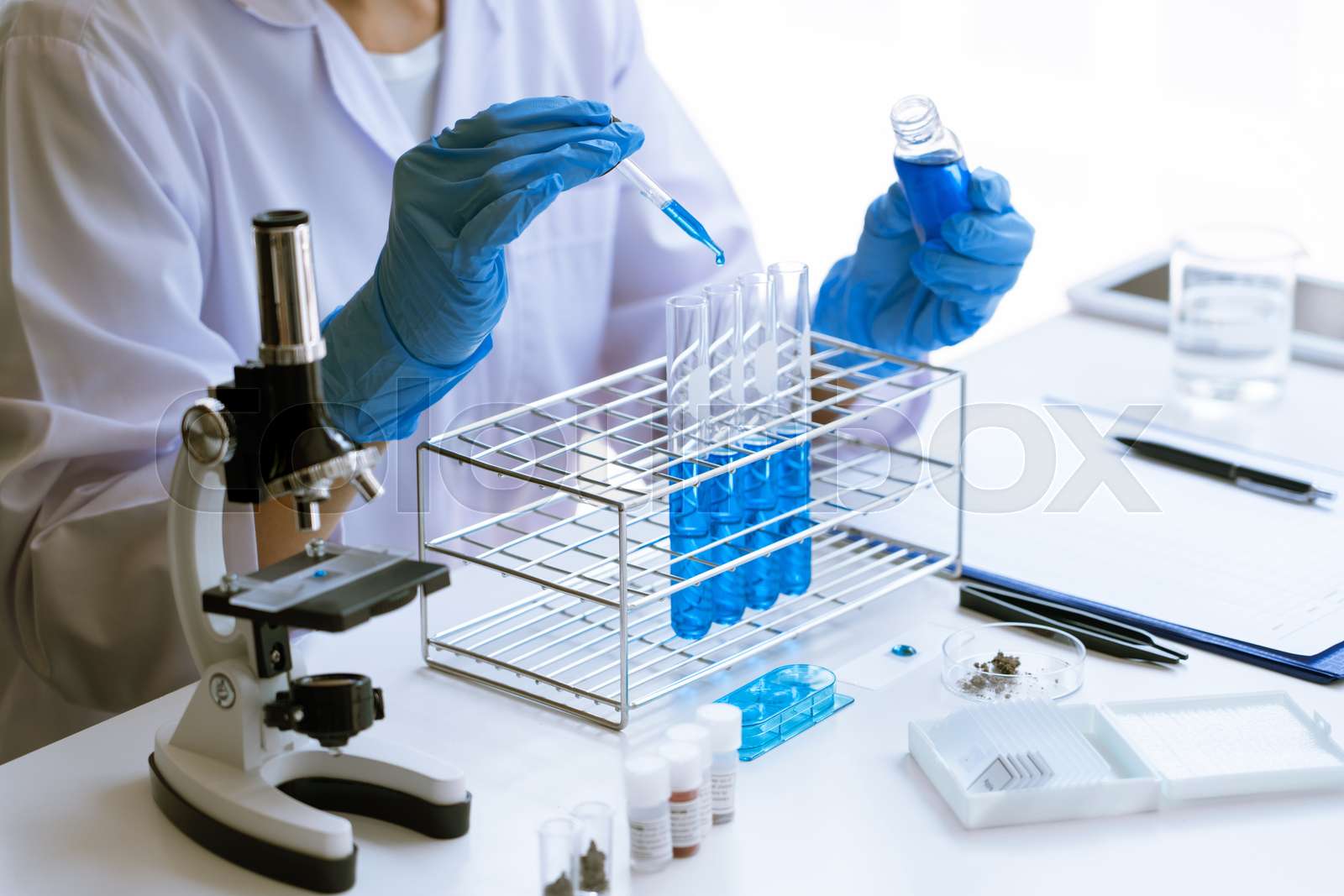 Scientist wear lab coat and protective wear are working with research ...