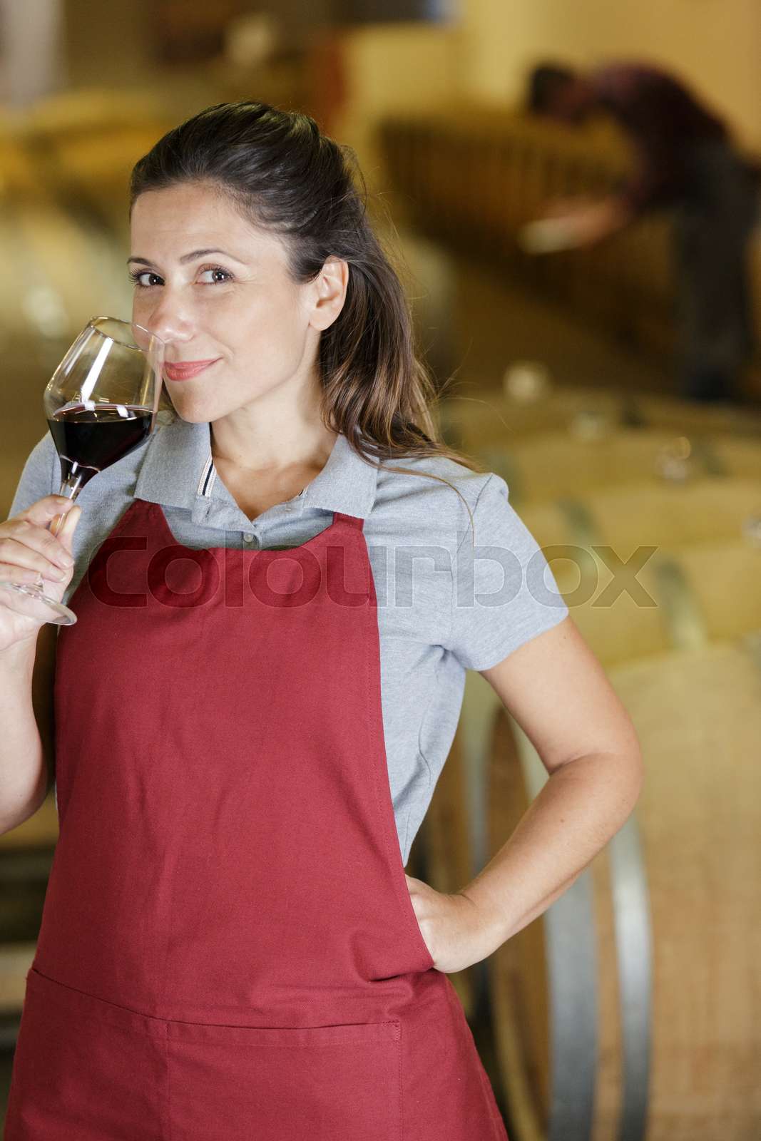woman sommelier is tasting wine at wine factory | Stock image | Colourbox