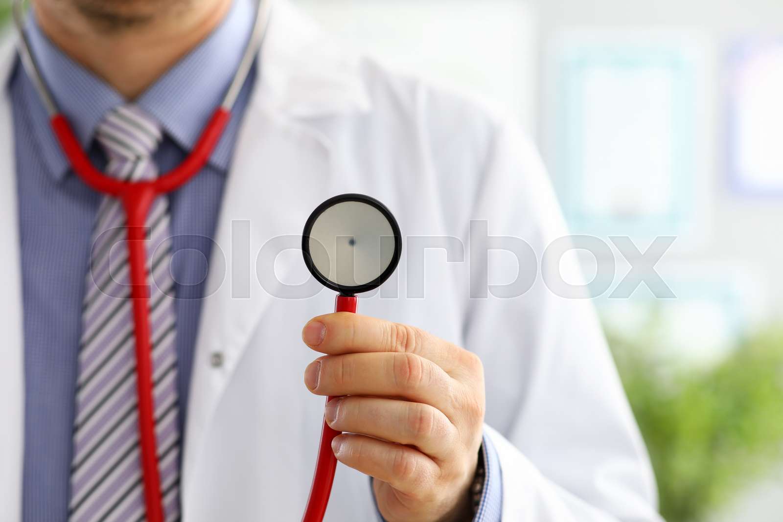 Male medicine doctor hand holding stethoscope head closeup | Stock ...