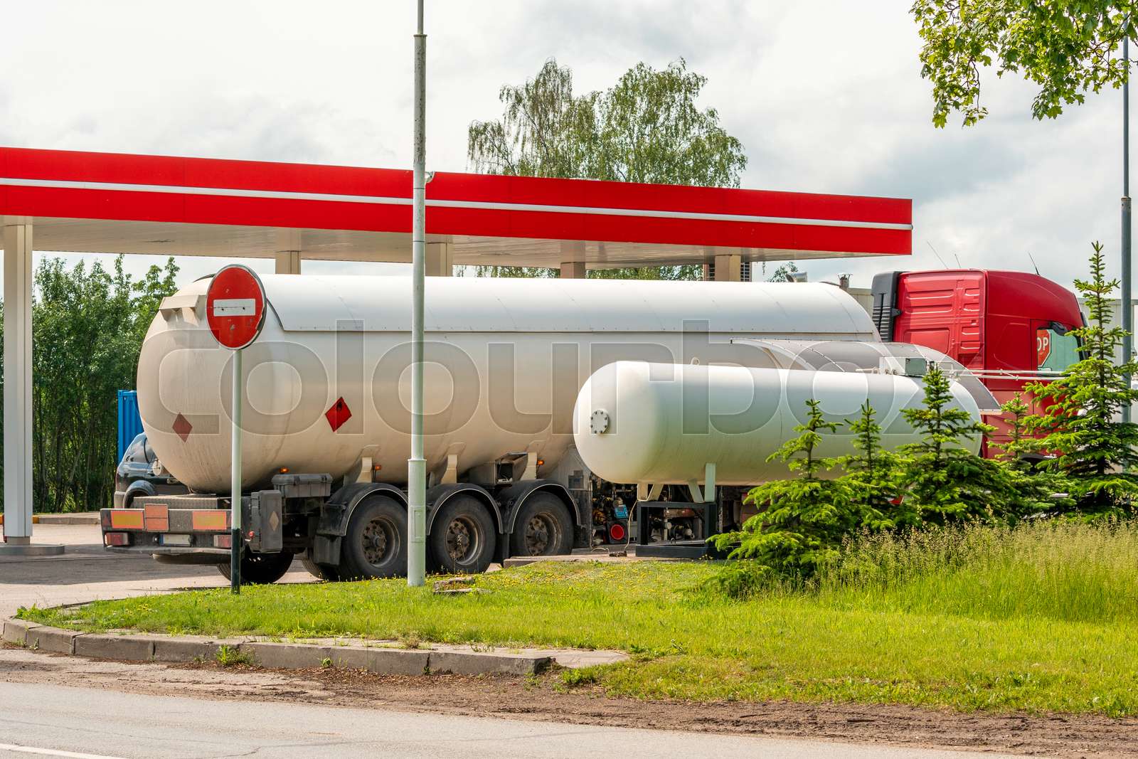 Tanker gas truck delivering fuel | Stock image | Colourbox
