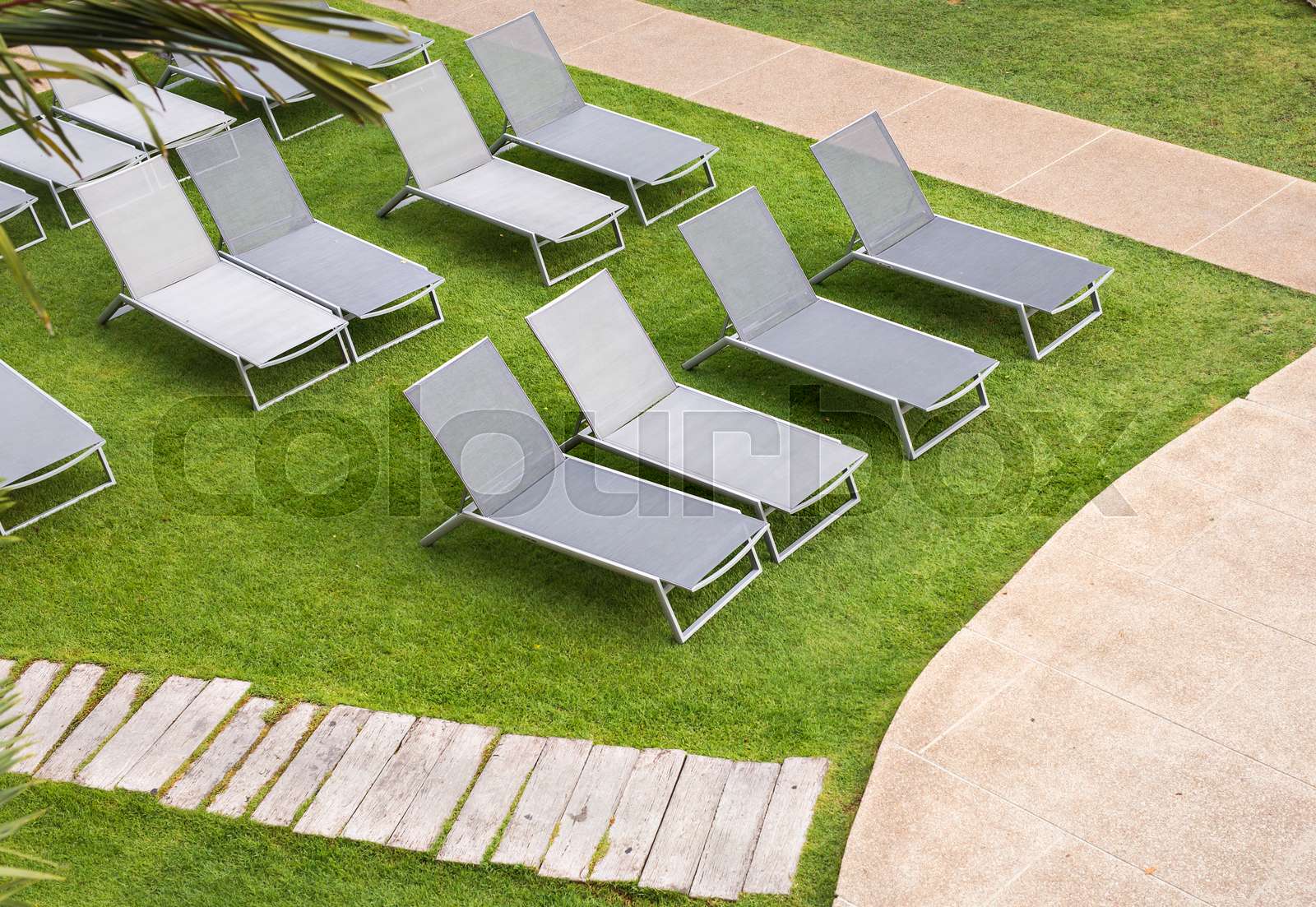 Beach chairs near swimming pool | Stock image | Colourbox