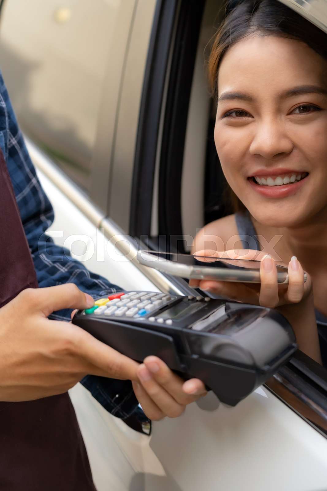 Asian customer make contactless mobile payment Drive thru | Stock image ...