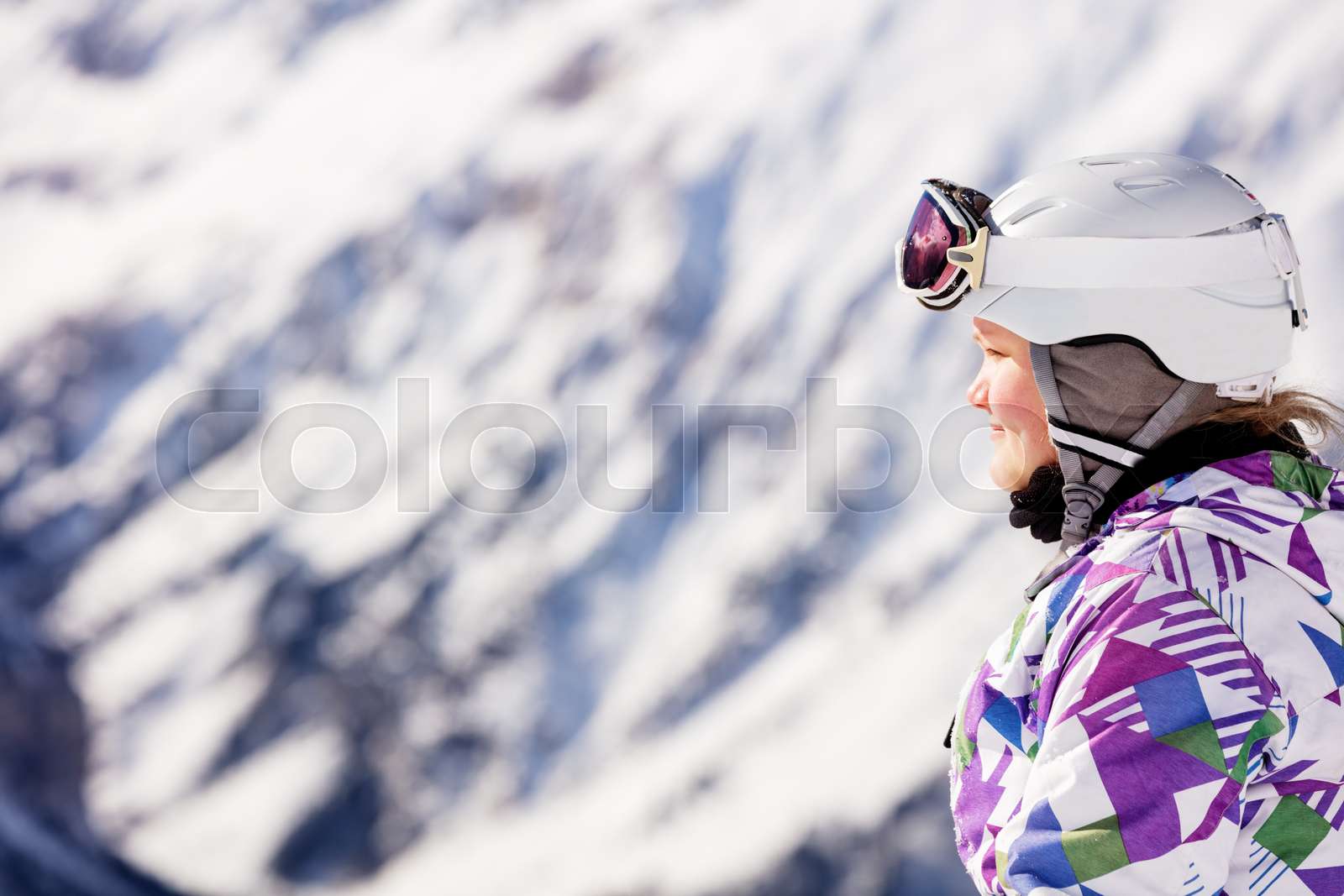 Profile portrait of ski teen girl over mountain | Stock image | Colourbox