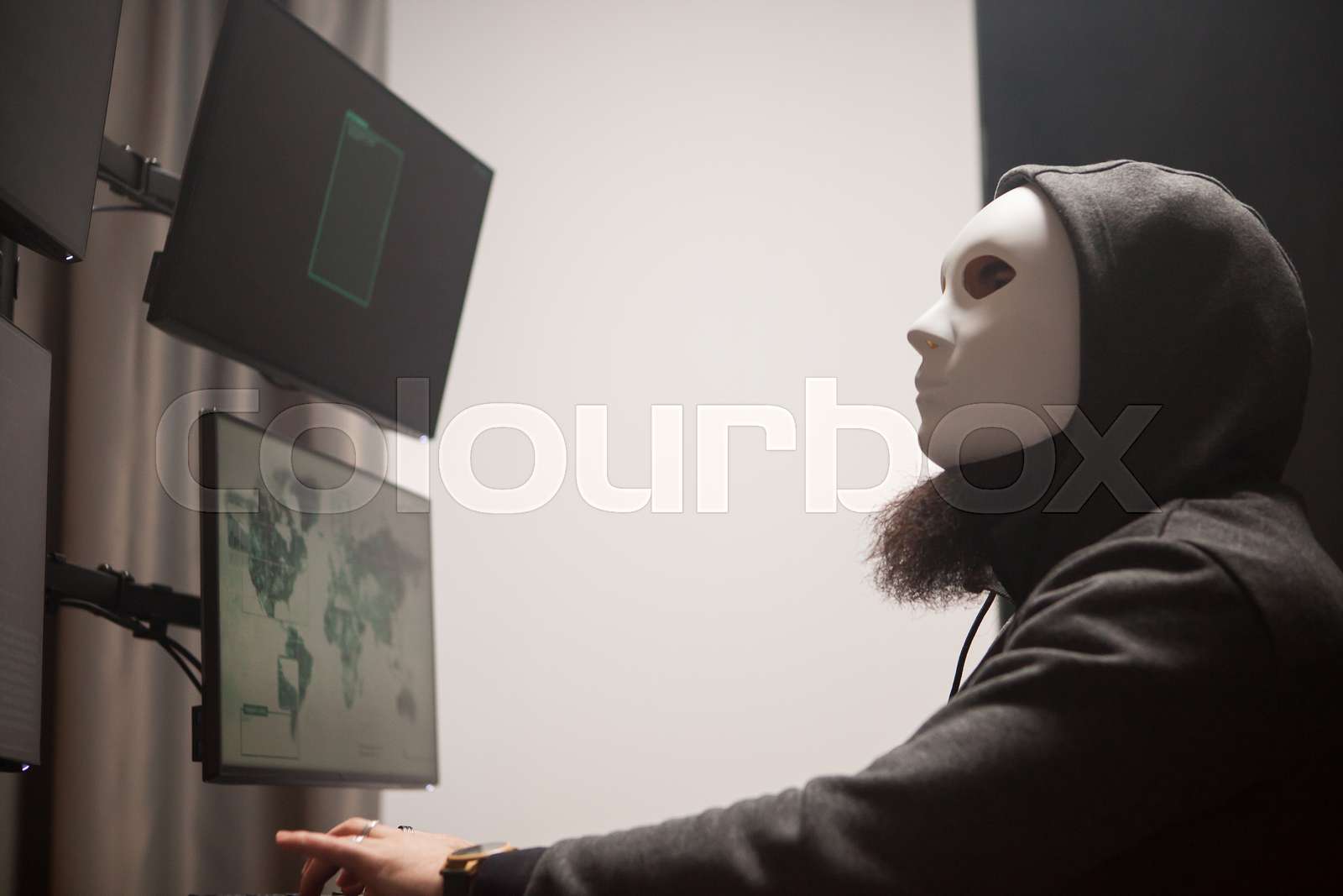 Side view of masked and dangerous hacker | Stock image | Colourbox