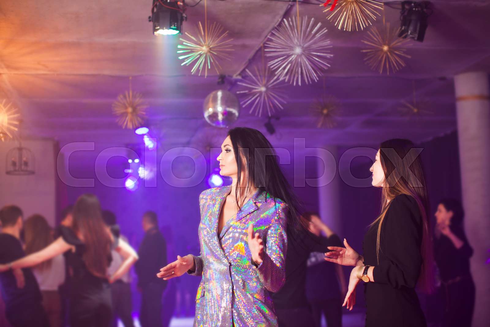 The busy nightlife of glamorous young girls | Stock image | Colourbox
