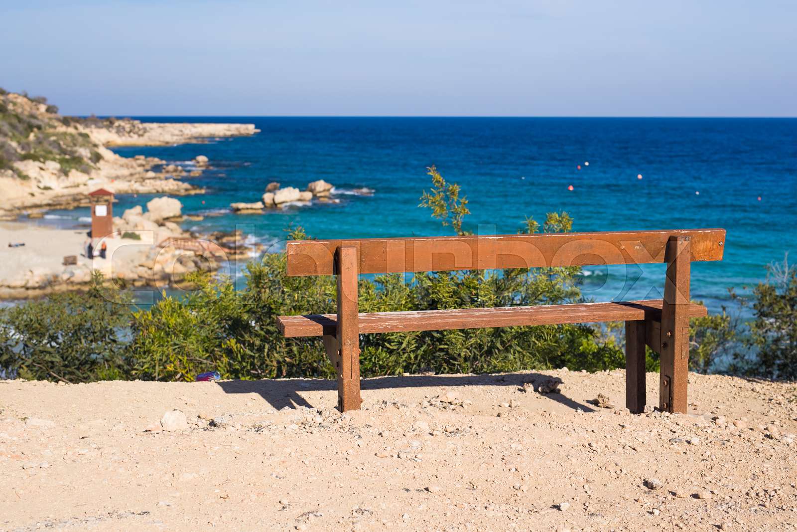Wooden bench in front of the sea | Stock image | Colourbox
