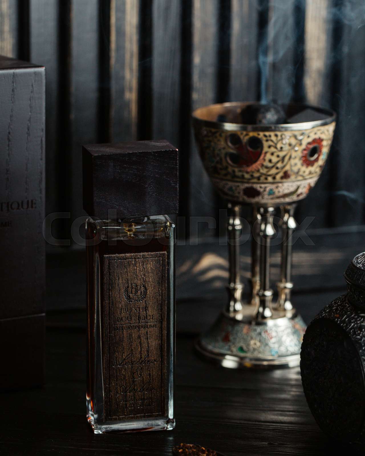 parfum in bottle decorated with wood | Stock image | Colourbox