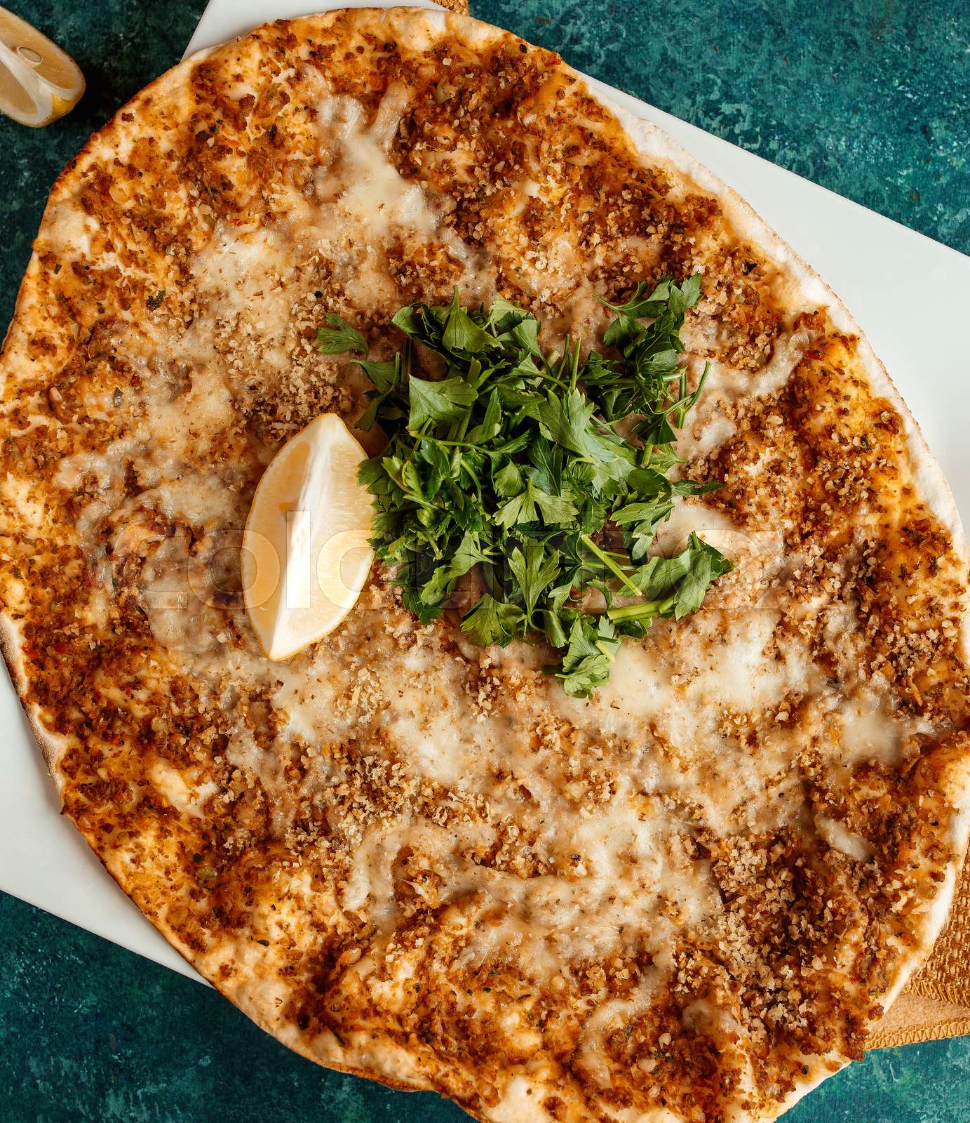 turkish lahmajun with cheese and meat and a slice of lemon | Stock ...