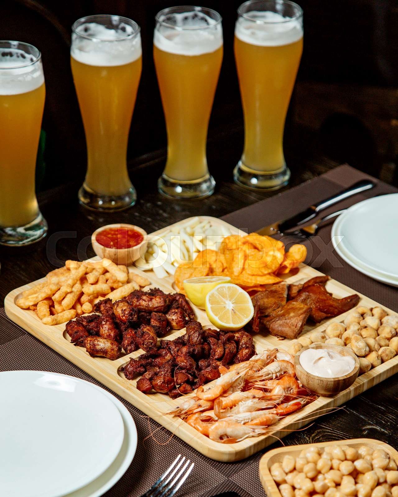 beer set with various snacks and lots of beer | Stock image | Colourbox