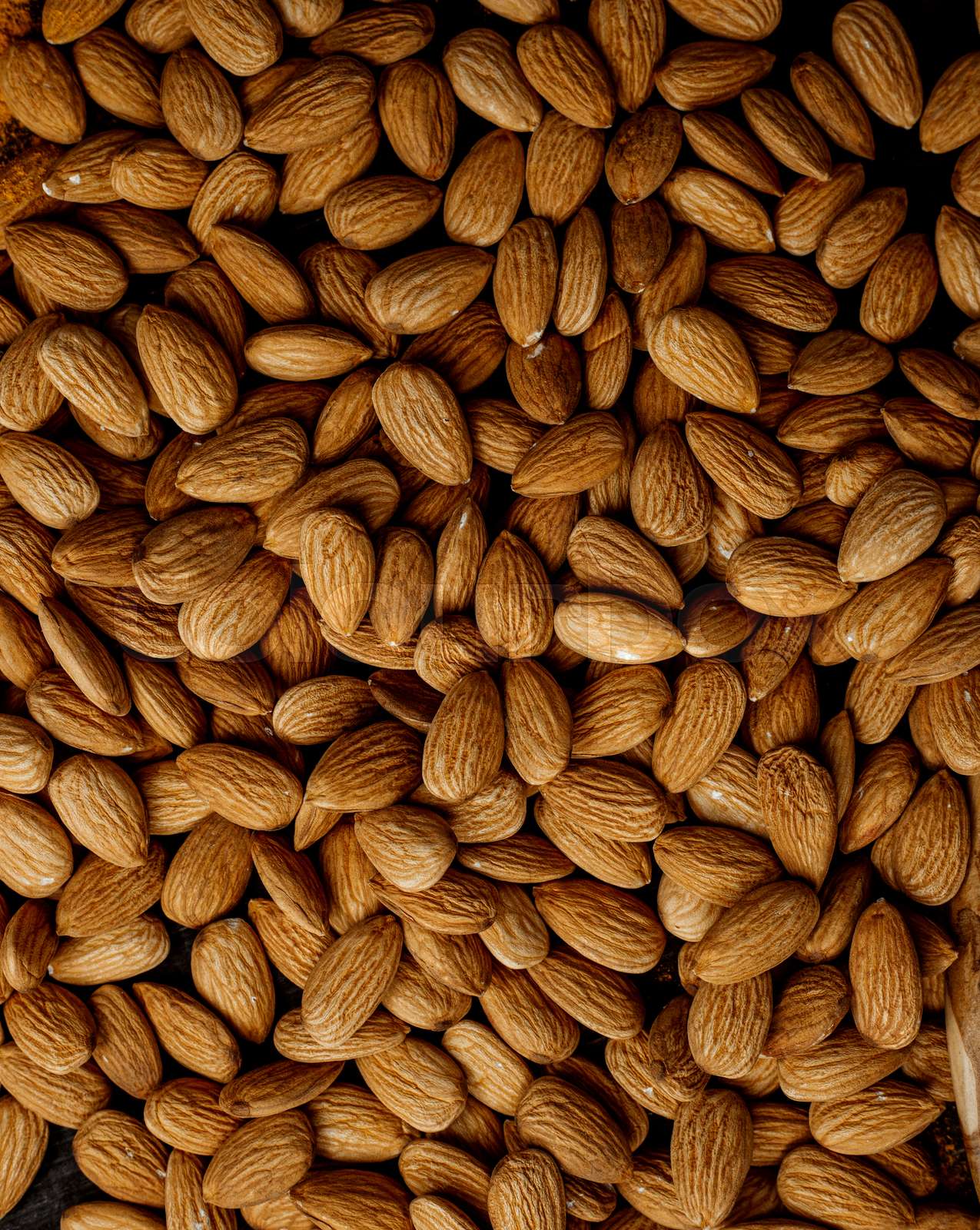 Almond wallpaper dried almonds with skin | Stock image | Colourbox