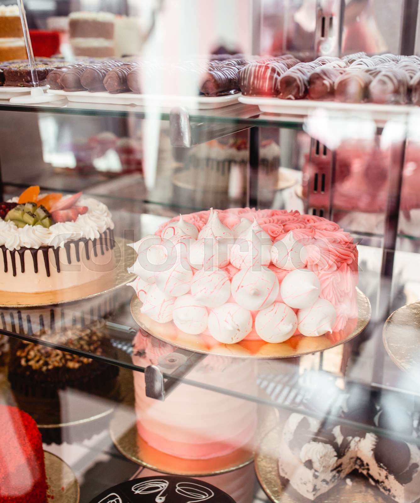 Cake display with cakes cookies and desserts | Stock image | Colourbox