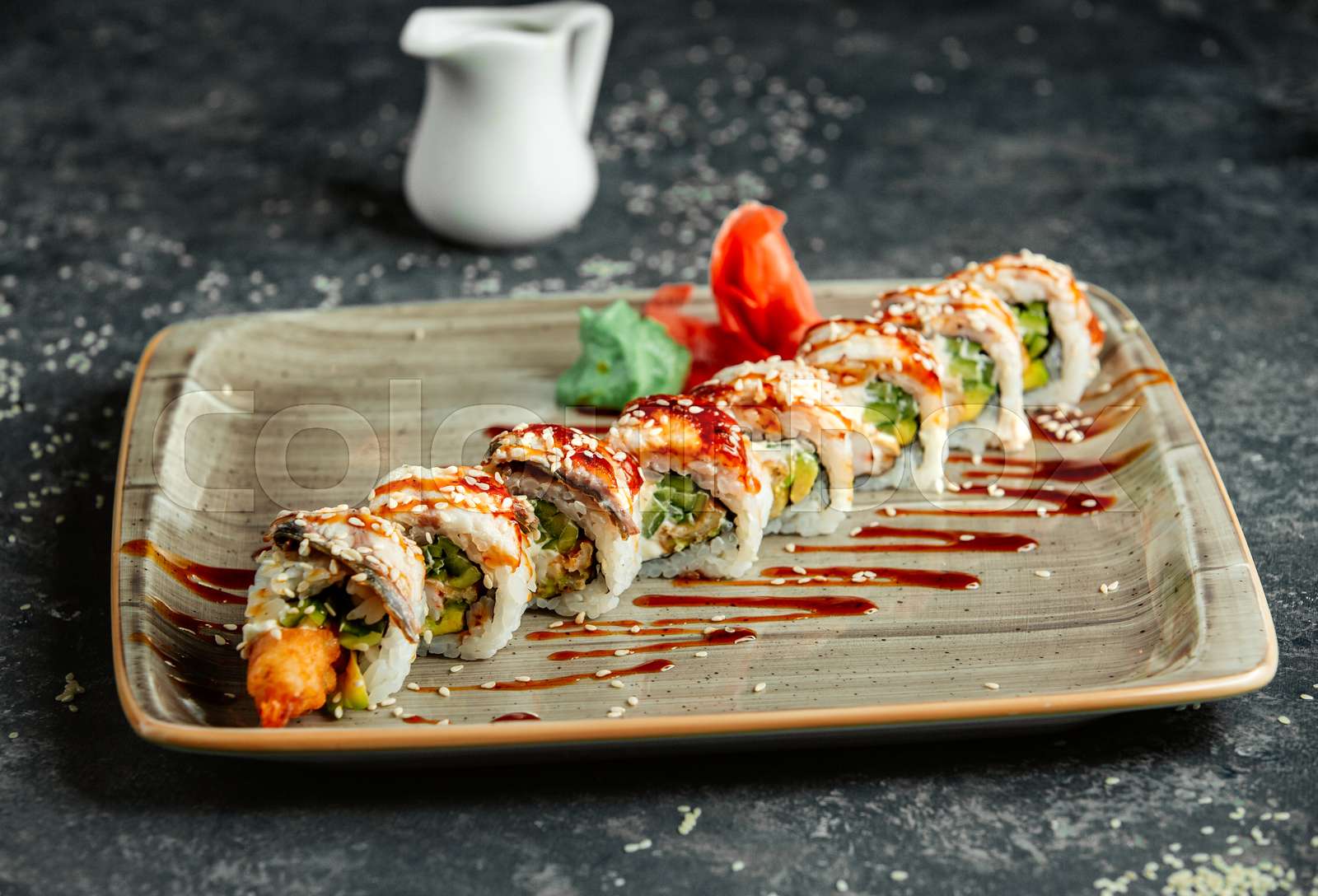 A plate of ebi sushi roll served with wasabi and ginger | Stock image ...