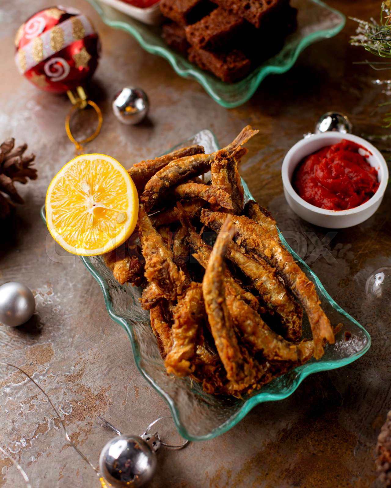 fried fish with lemon slice and ketchup | Stock image | Colourbox