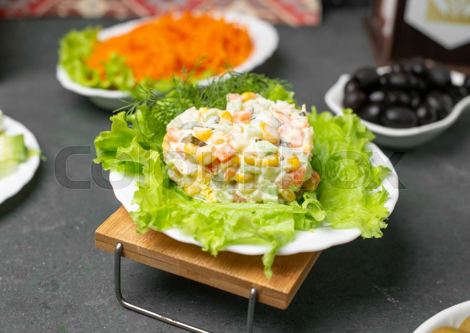 Russian stolichni salad in heart shape on a lettuce | Stock image ...