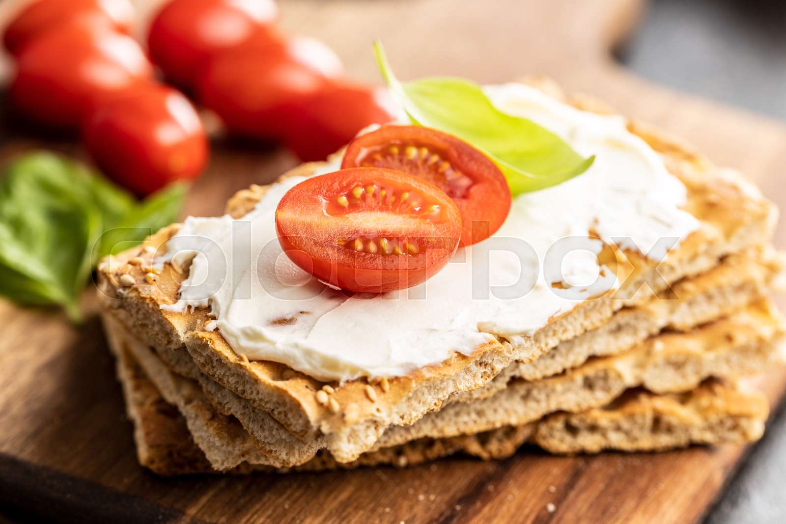Dieting knackebrot. Crispbread with creamy cheese., cherry tomato and ...