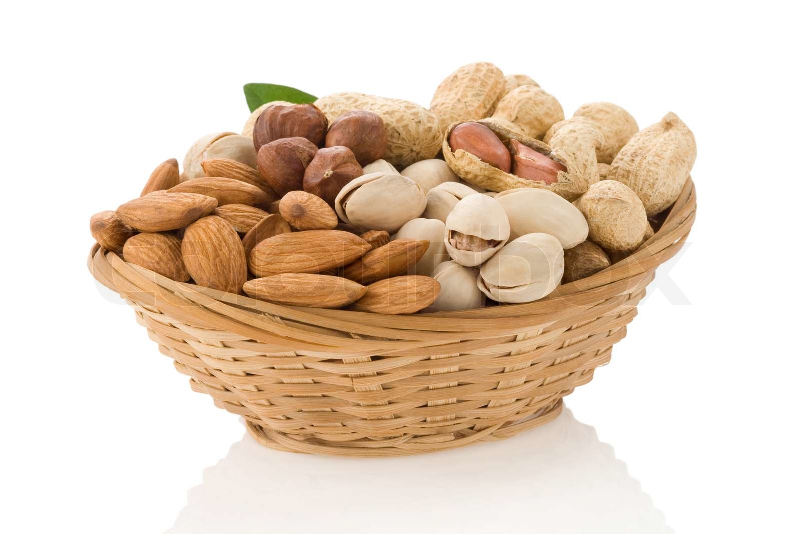 set of nuts in bowl isolated on white | Stock image | Colourbox