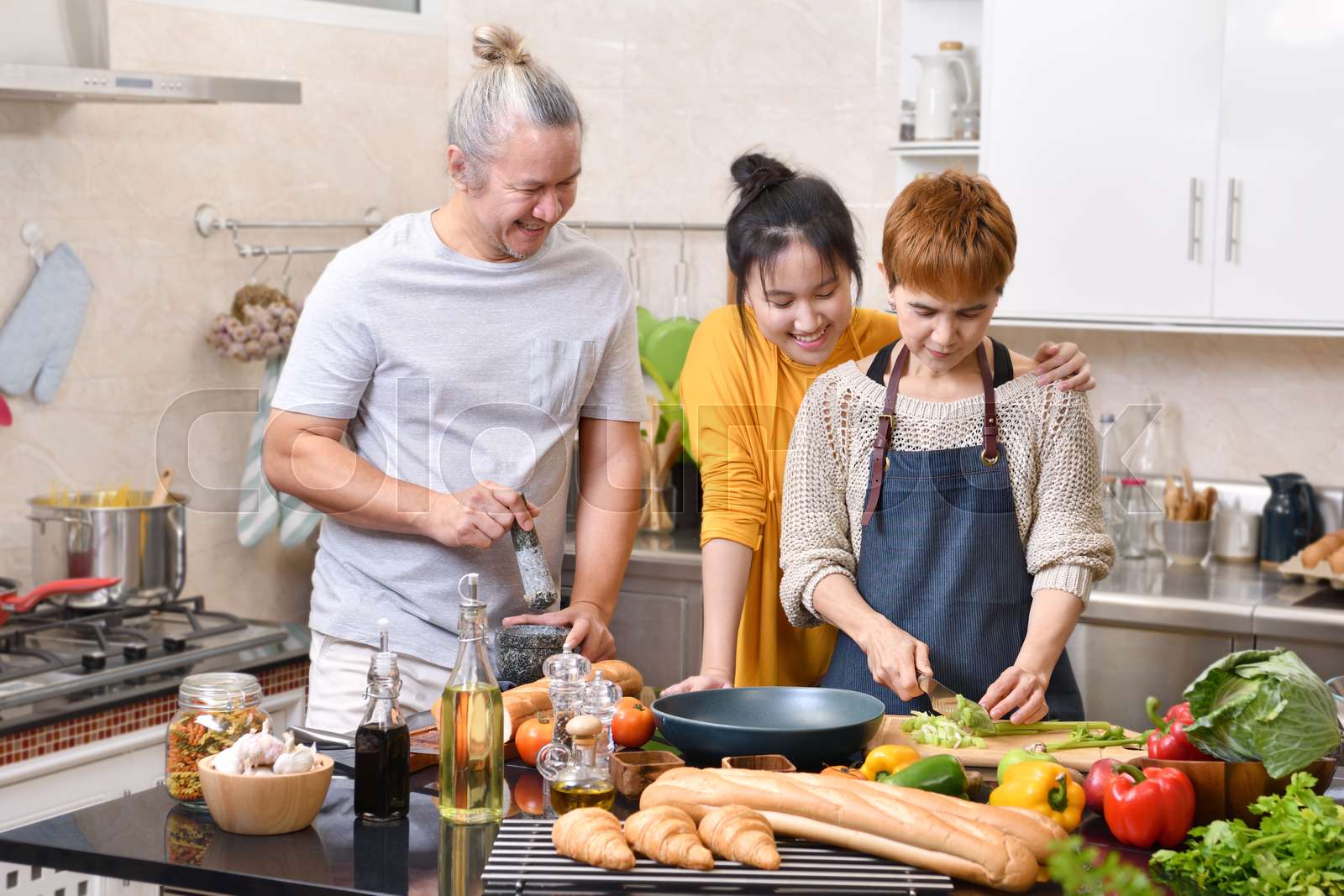 Family cooking in the kitchen together | Stock image | Colourbox
