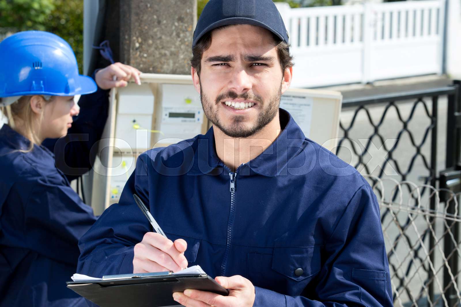 worker inspector holding clipboard outside construction | Stock image ...